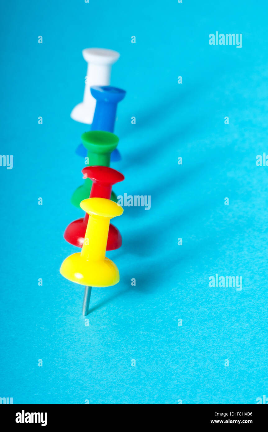 Office pins on the paper Stock Photo - Alamy