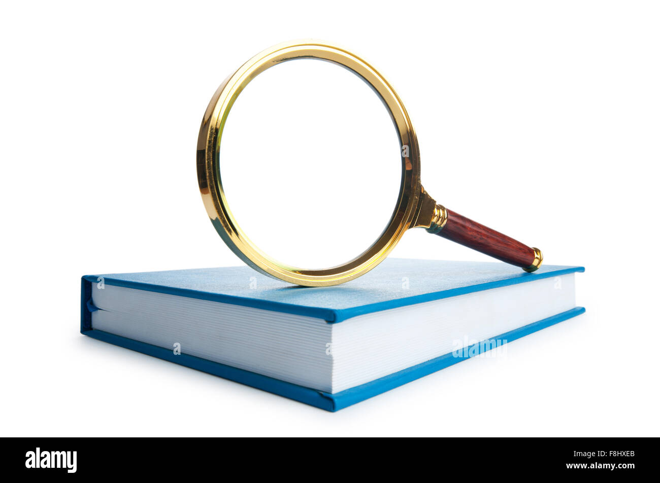 Book magnifying glass over white hi-res stock photography and images ...