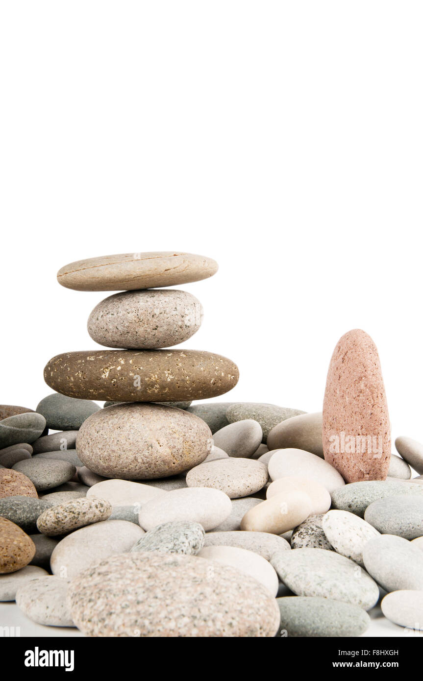 Stack of pebbles isolated on the white Stock Photo - Alamy