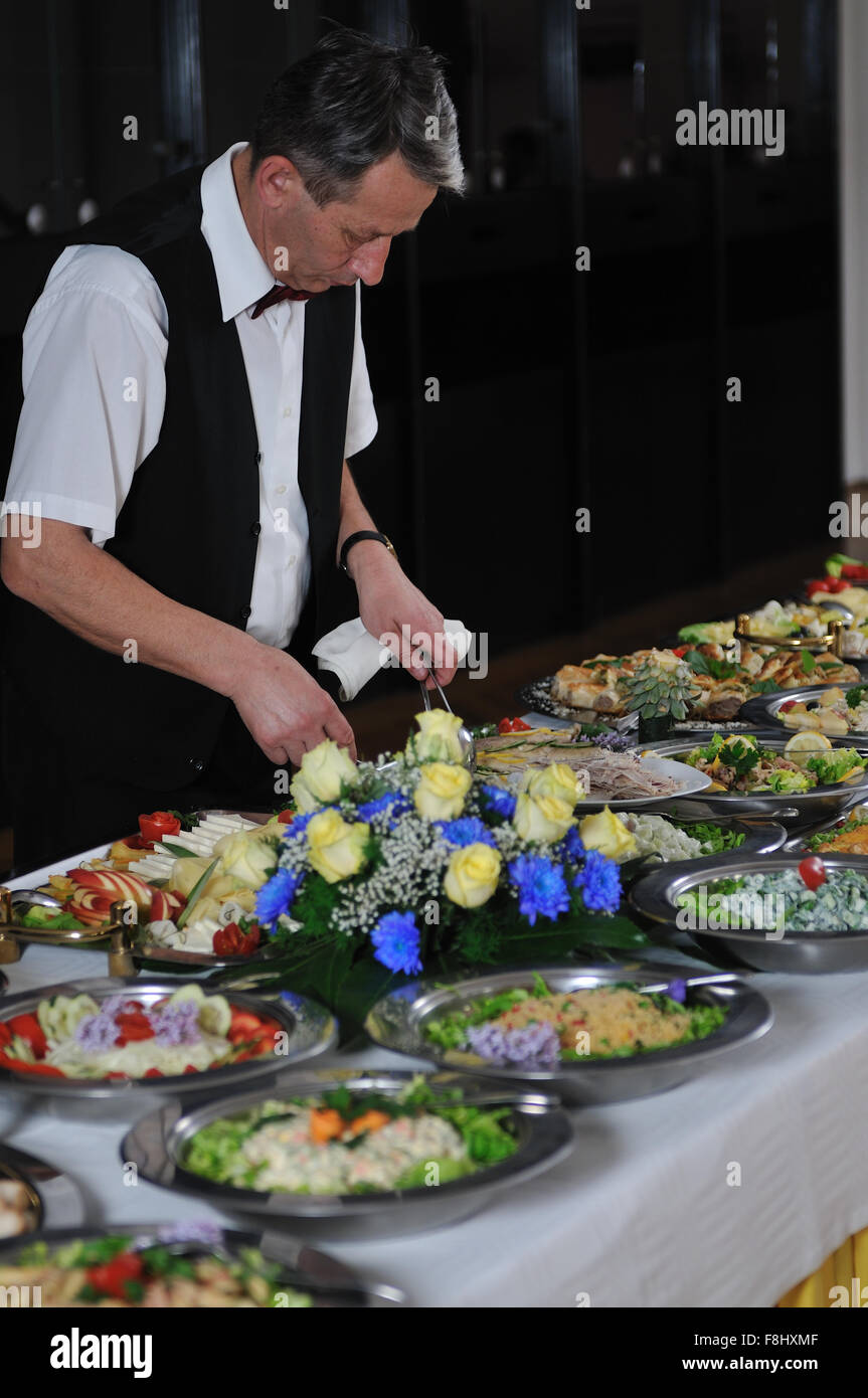 catering buffet food party preparation man Stock Photo - Alamy