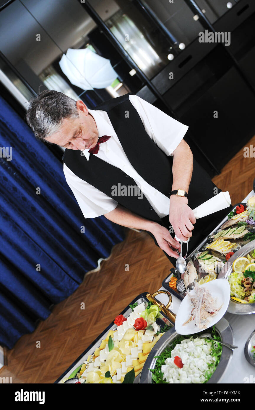 catering buffet food party preparation man Stock Photo - Alamy