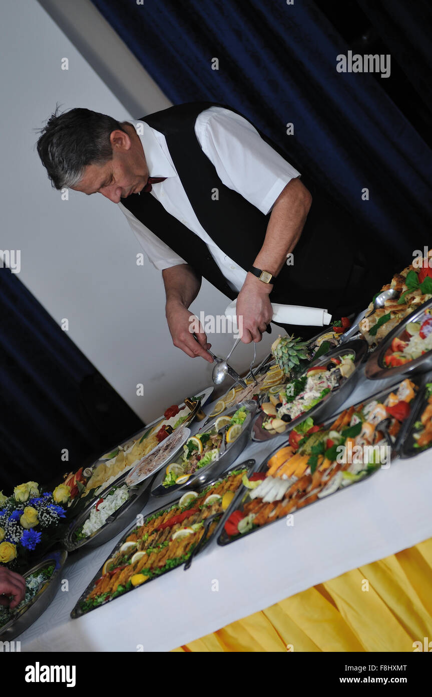 catering buffet food party preparation man Stock Photo - Alamy
