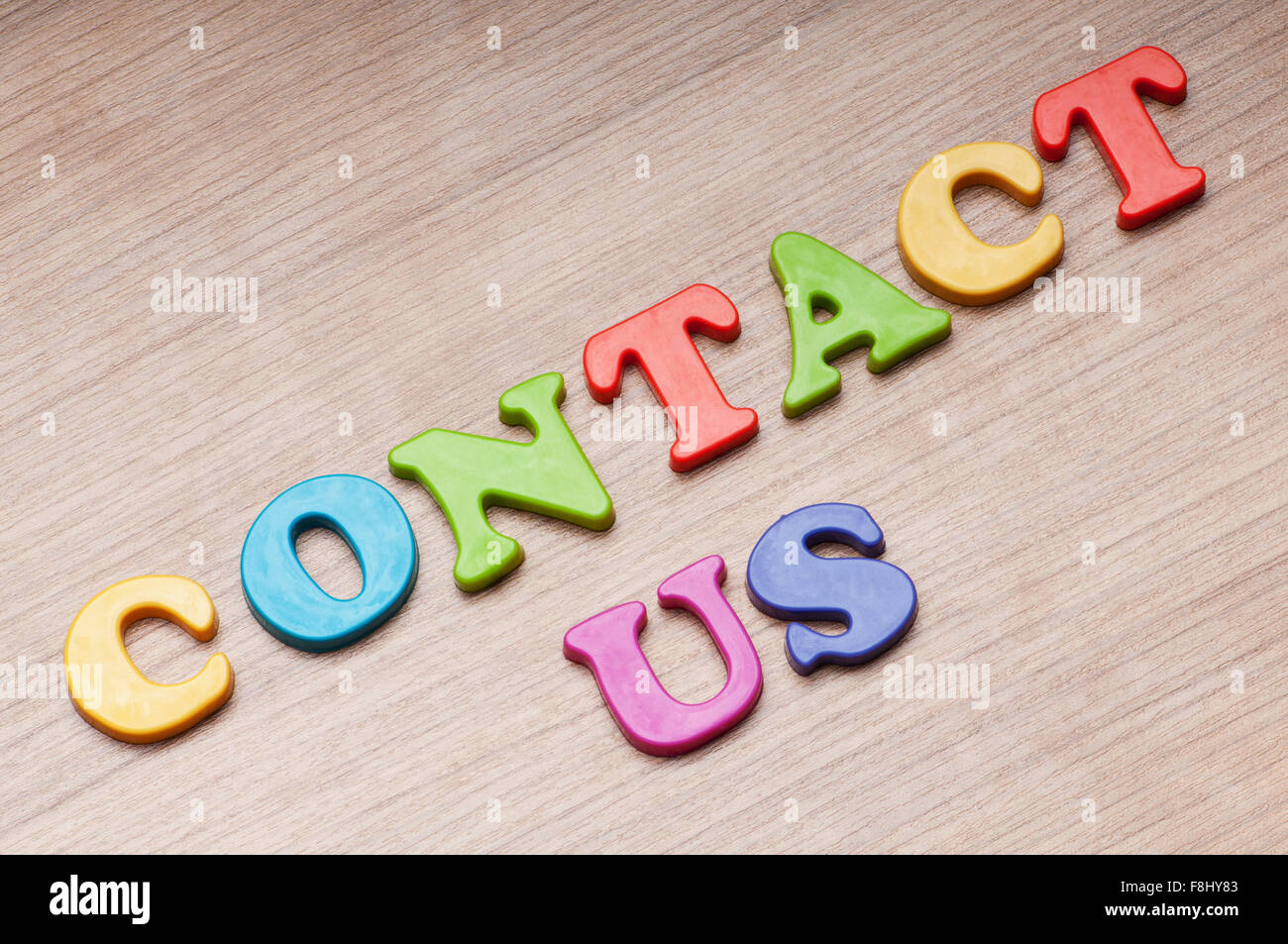 Contact us concept with letters on background Stock Photo - Alamy
