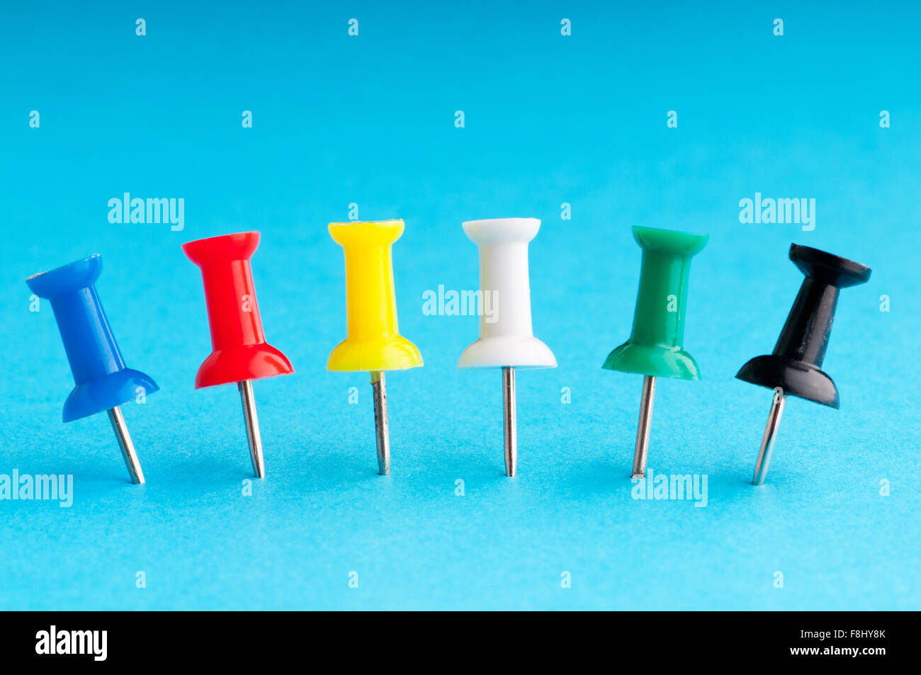 Office pins on the paper Stock Photo - Alamy