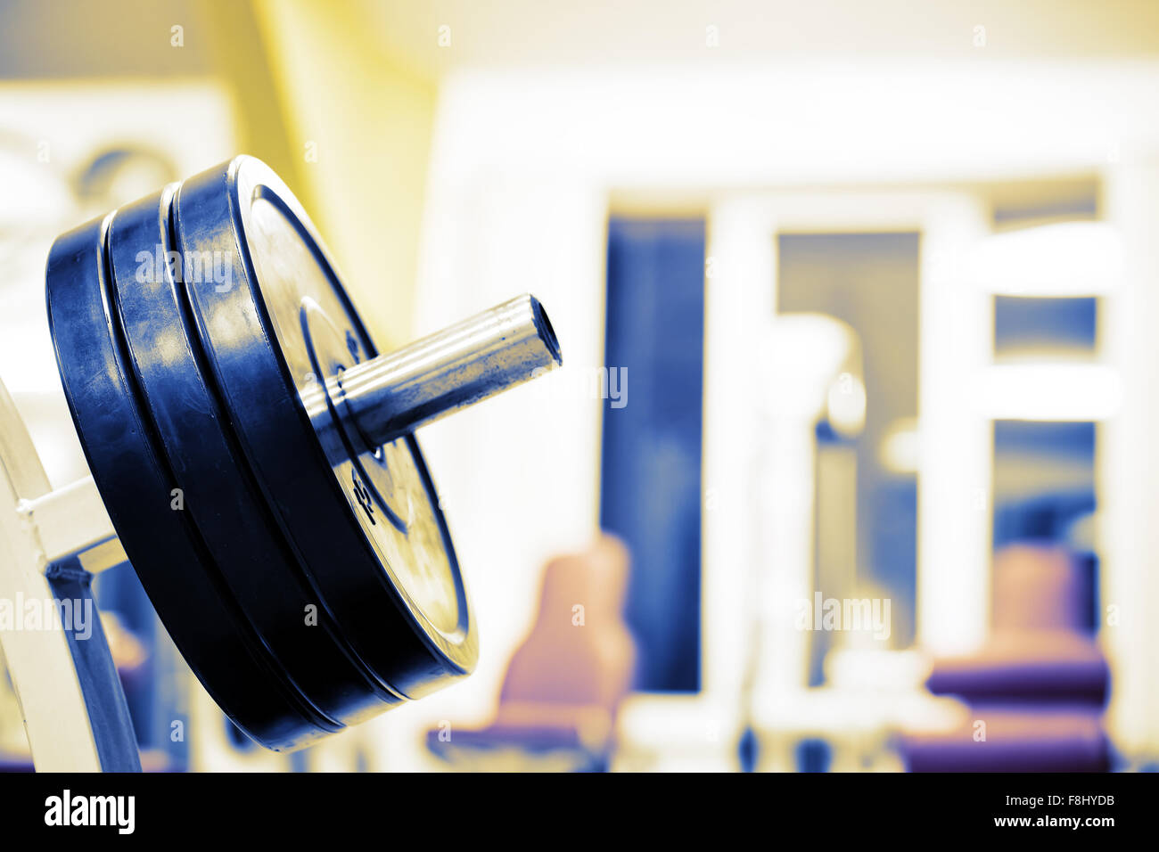 Rubber wheels for barbell on background blur window Stock Photo - Alamy