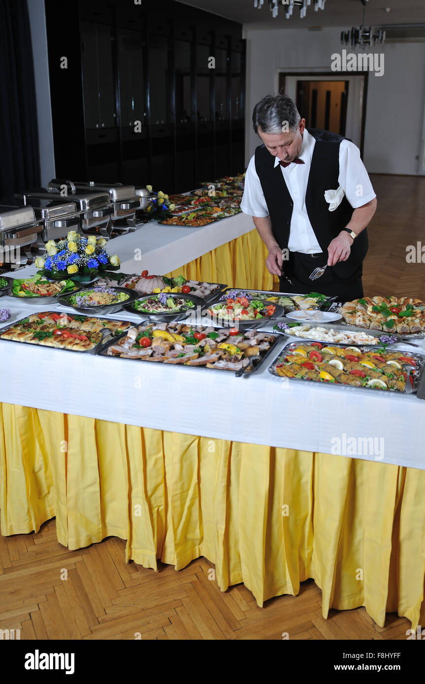catering buffet food party preparation man Stock Photo - Alamy
