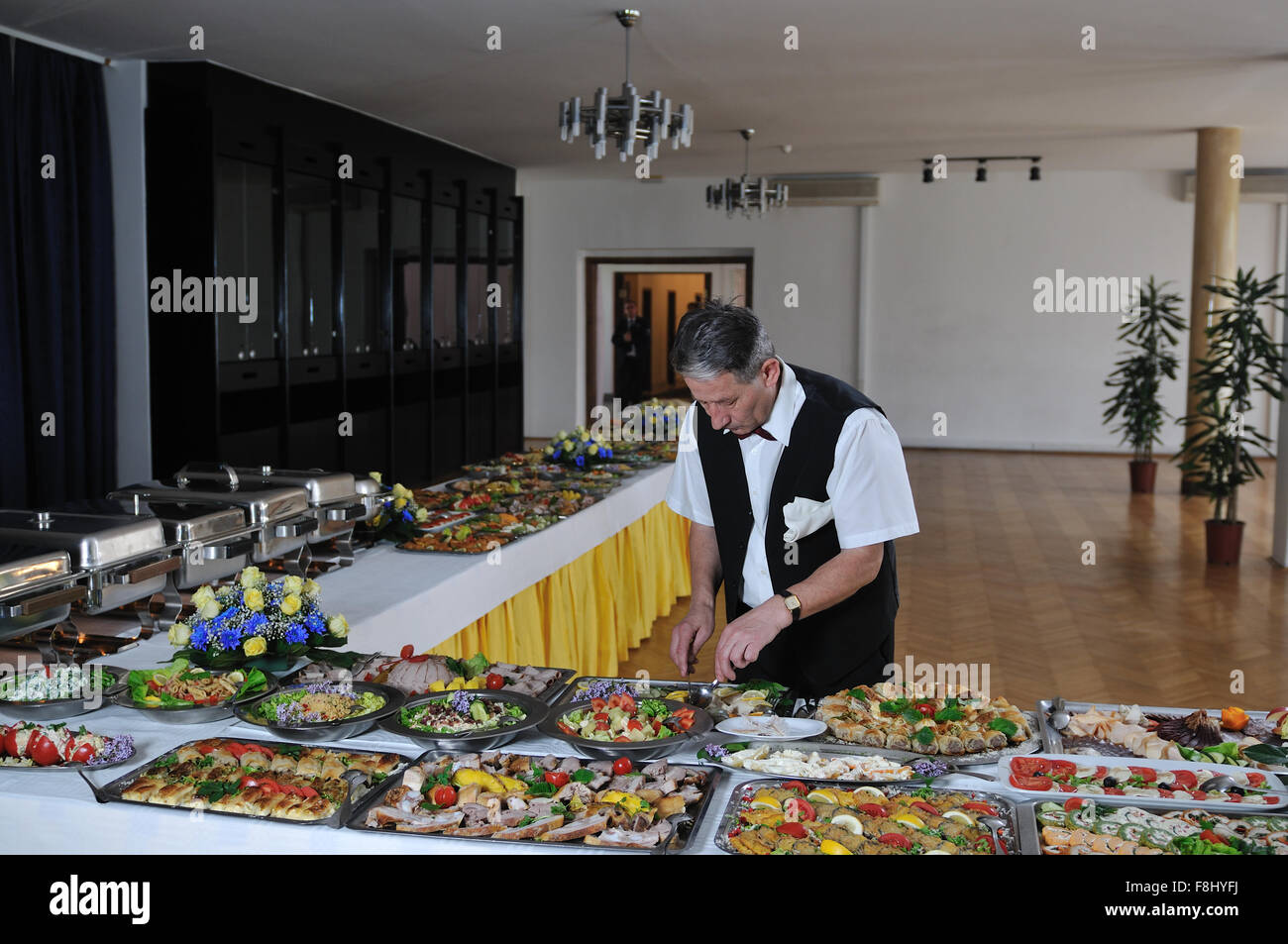 catering buffet food party preparation man Stock Photo - Alamy