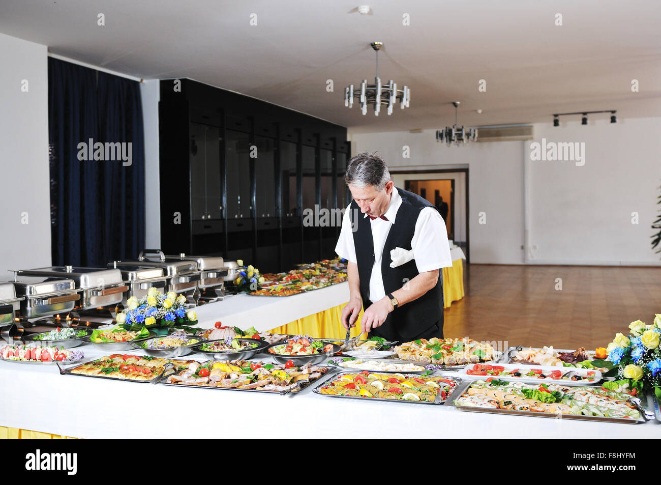 catering buffet food party preparation man Stock Photo - Alamy