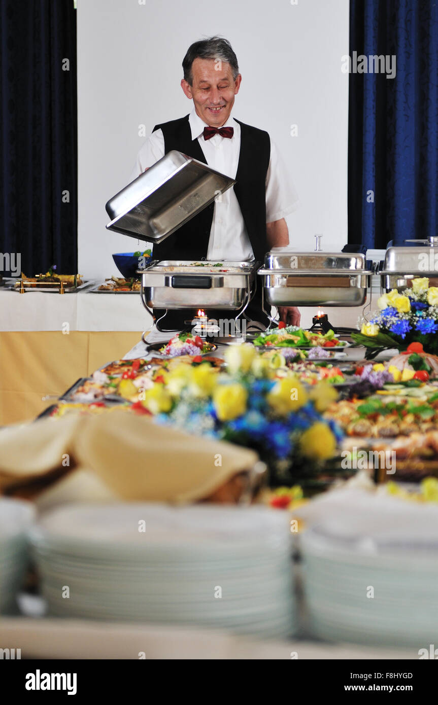catering buffet food party preparation man Stock Photo - Alamy
