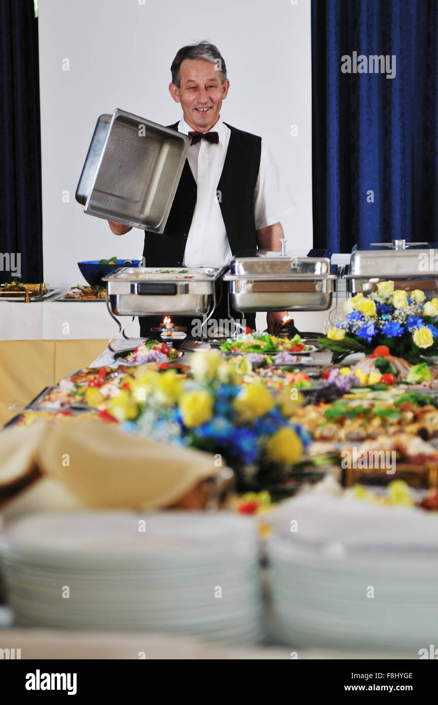 catering buffet food party preparation man Stock Photo - Alamy