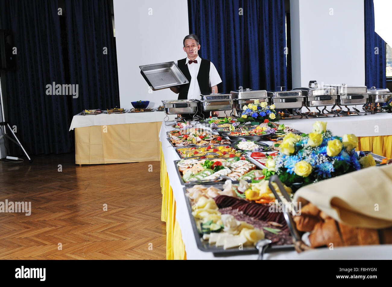 catering buffet food party preparation man Stock Photo - Alamy