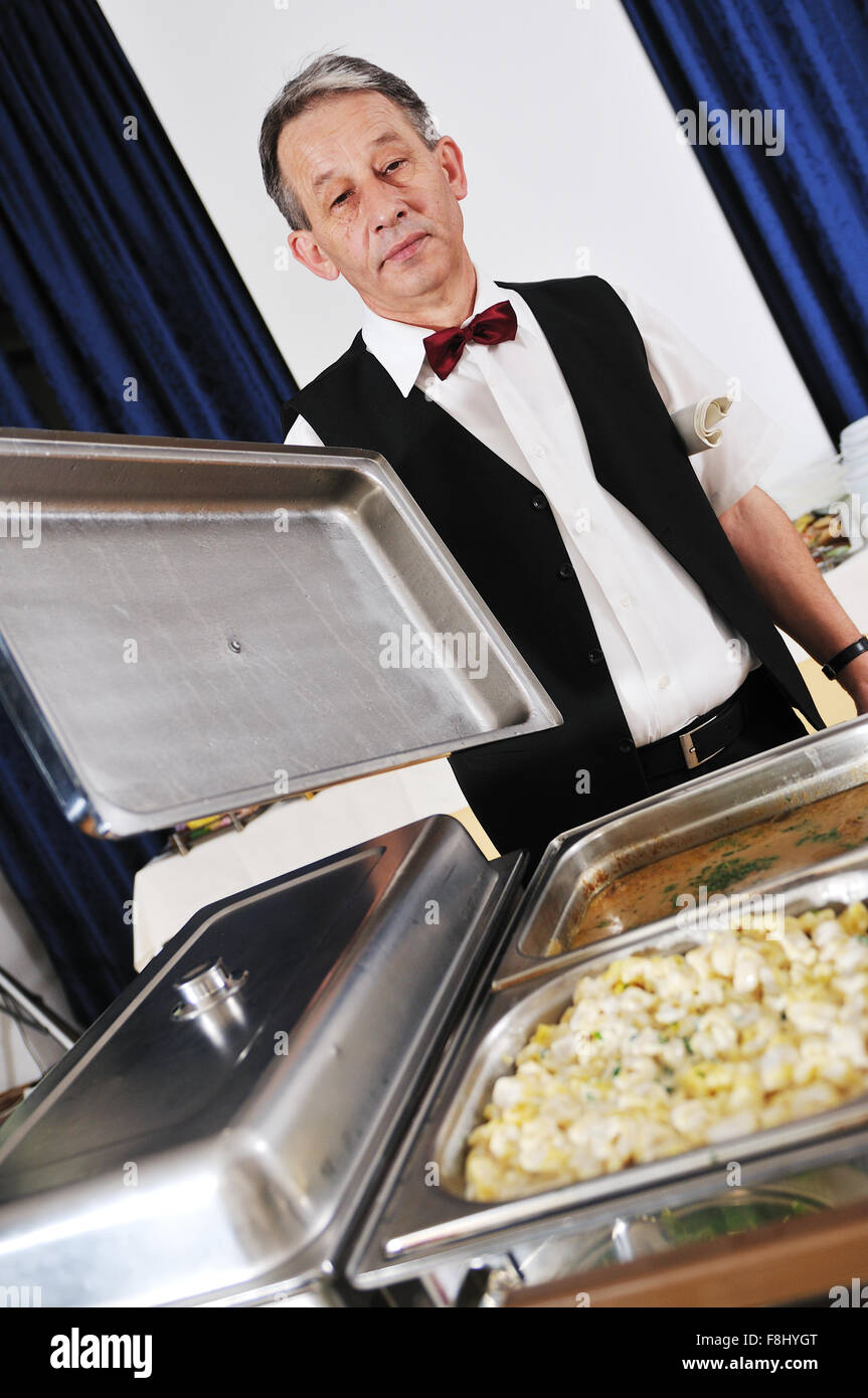 catering buffet food party preparation man Stock Photo - Alamy