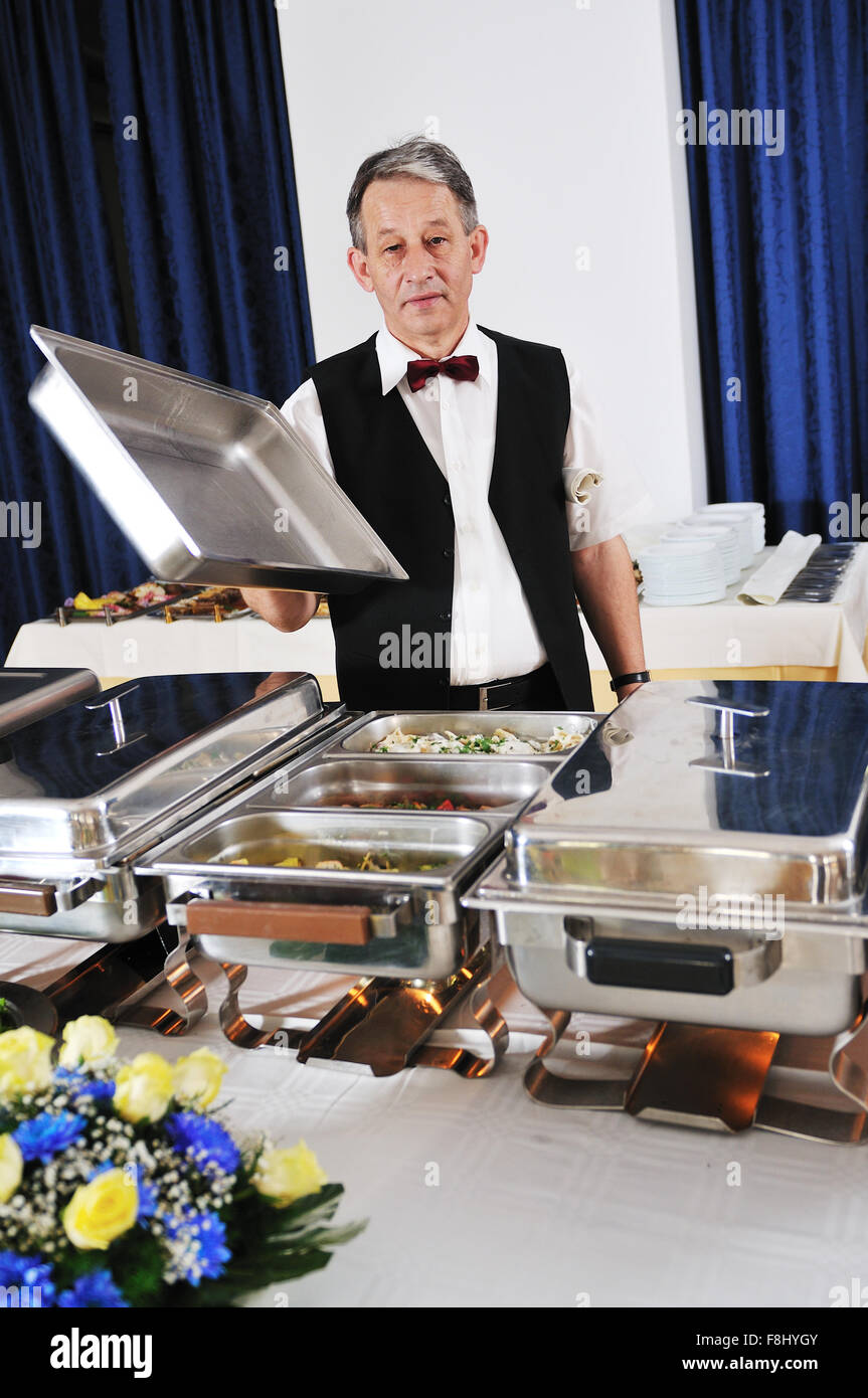 catering buffet food party preparation man Stock Photo - Alamy