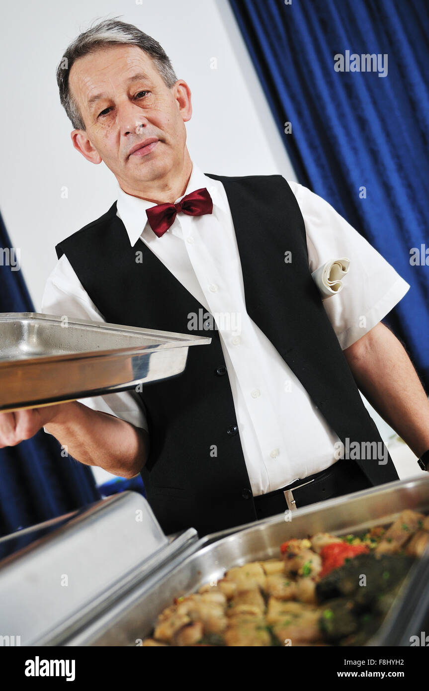 catering buffet food party preparation man Stock Photo - Alamy
