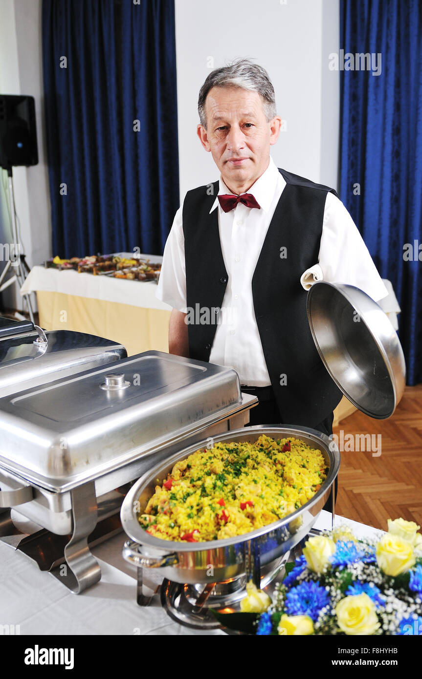 catering buffet food party preparation man Stock Photo - Alamy
