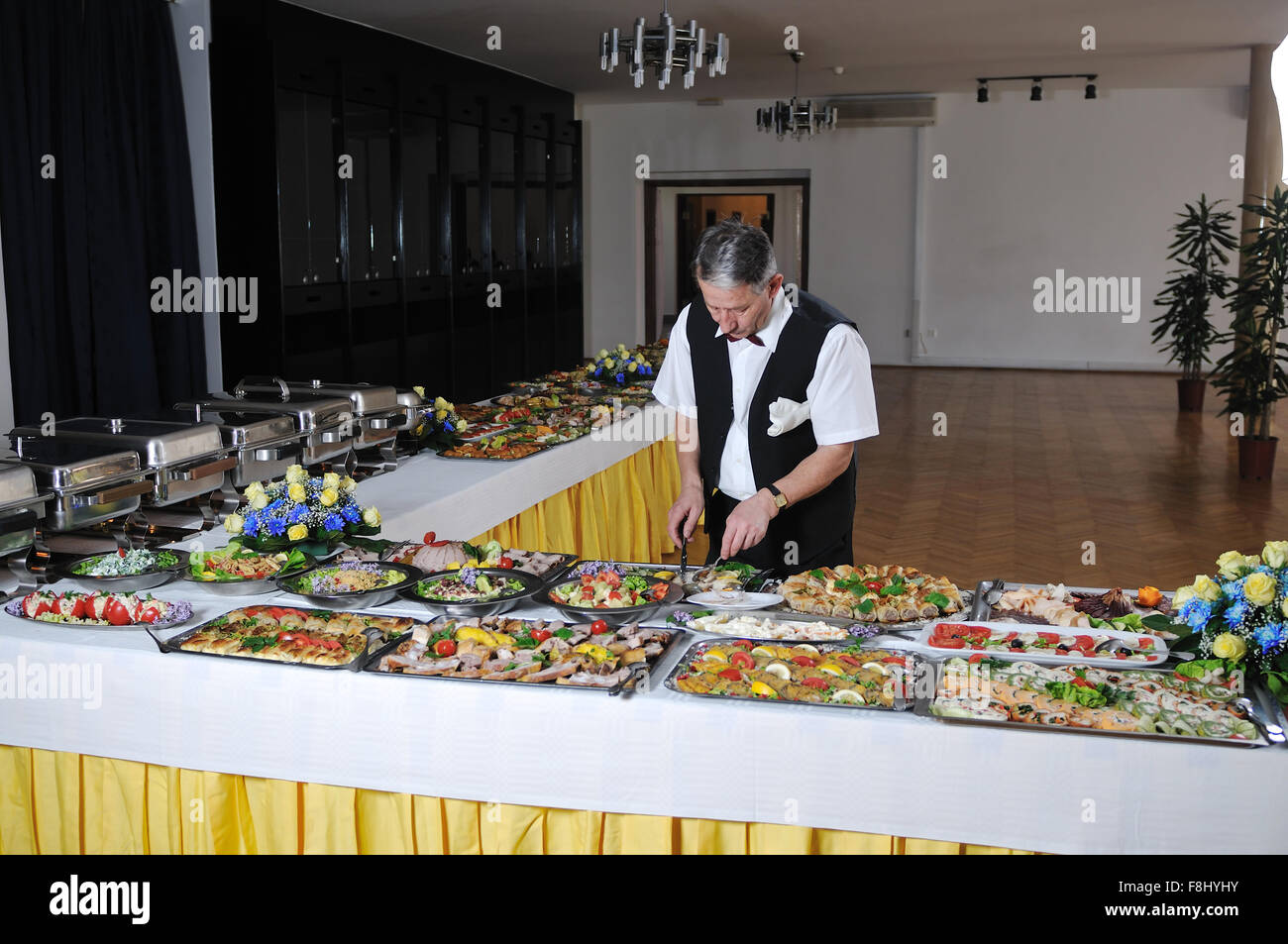 catering buffet food party preparation man Stock Photo - Alamy