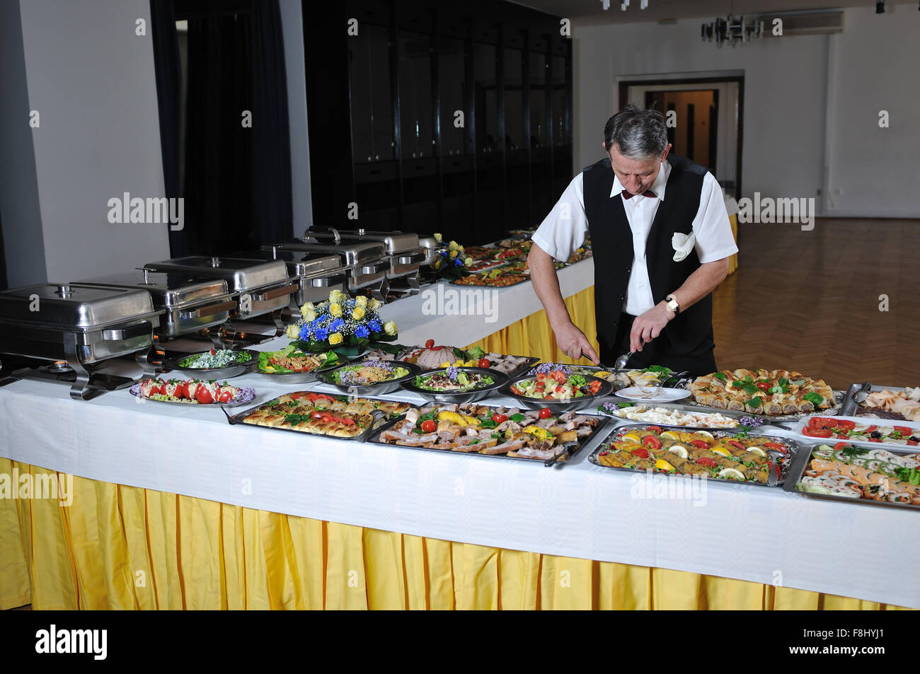 catering buffet food party preparation man Stock Photo - Alamy
