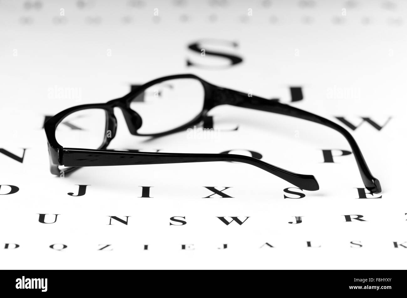 Optical reading glasses on the eyesight table Stock Photo - Alamy