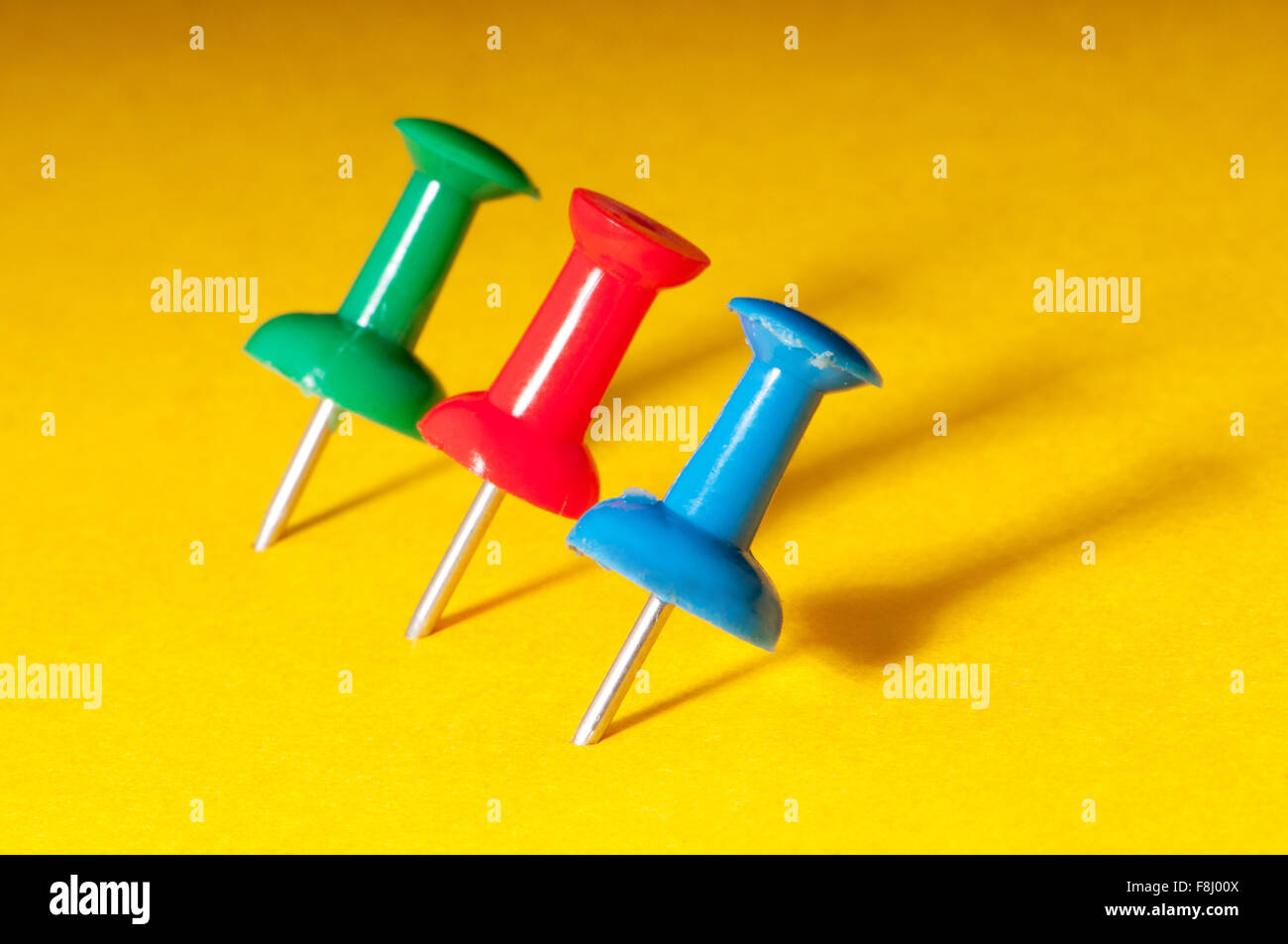 Office pins on the paper Stock Photo - Alamy