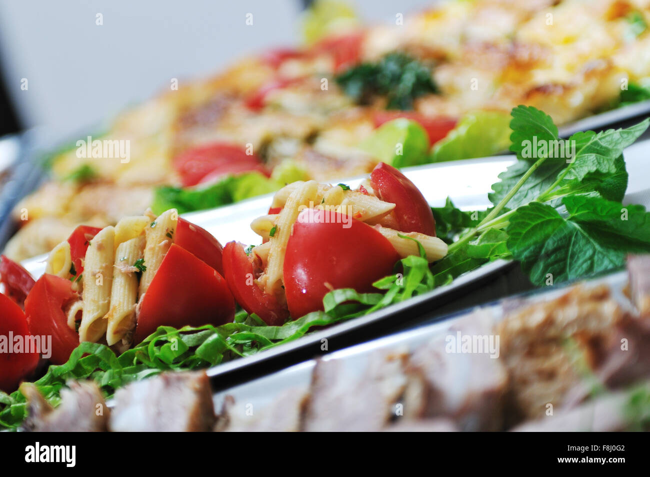 buffet catering food arangement on table Stock Photo - Alamy