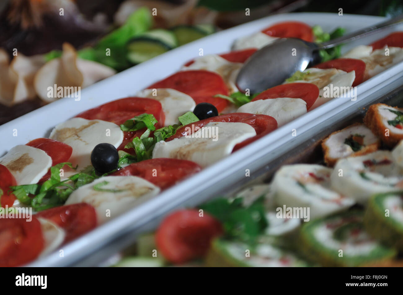 buffet catering food arangement on table Stock Photo - Alamy