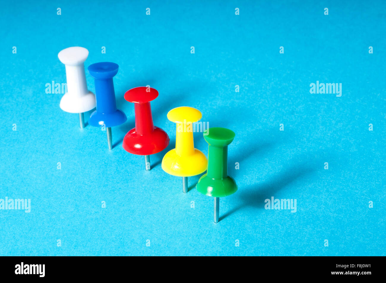 Office pins on the paper Stock Photo - Alamy
