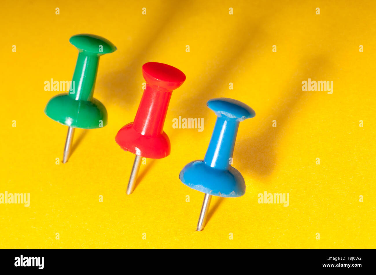 Office pins on the paper Stock Photo - Alamy