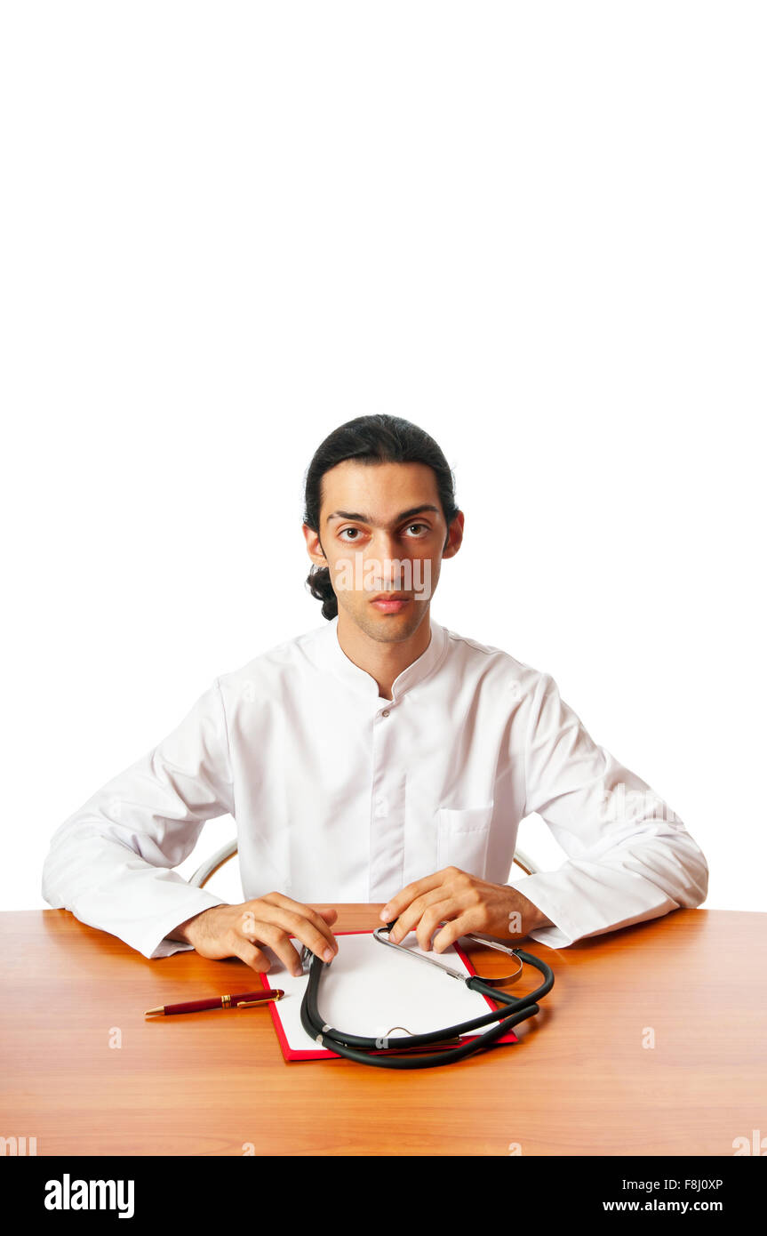Doctor sitting at the desk on white Stock Photo - Alamy