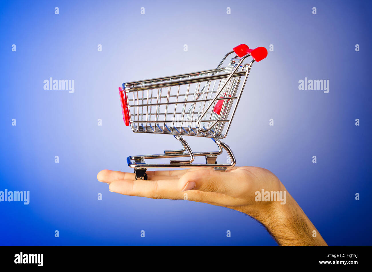 Business concept - Hands holding shopping cart Stock Photo - Alamy