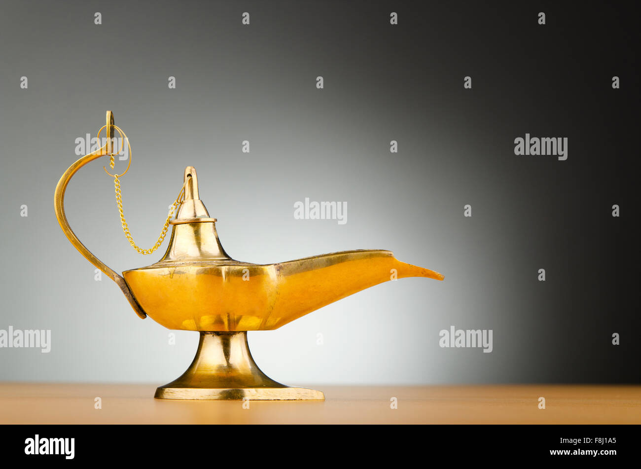 Ancient lamp against gradient background Stock Photo - Alamy