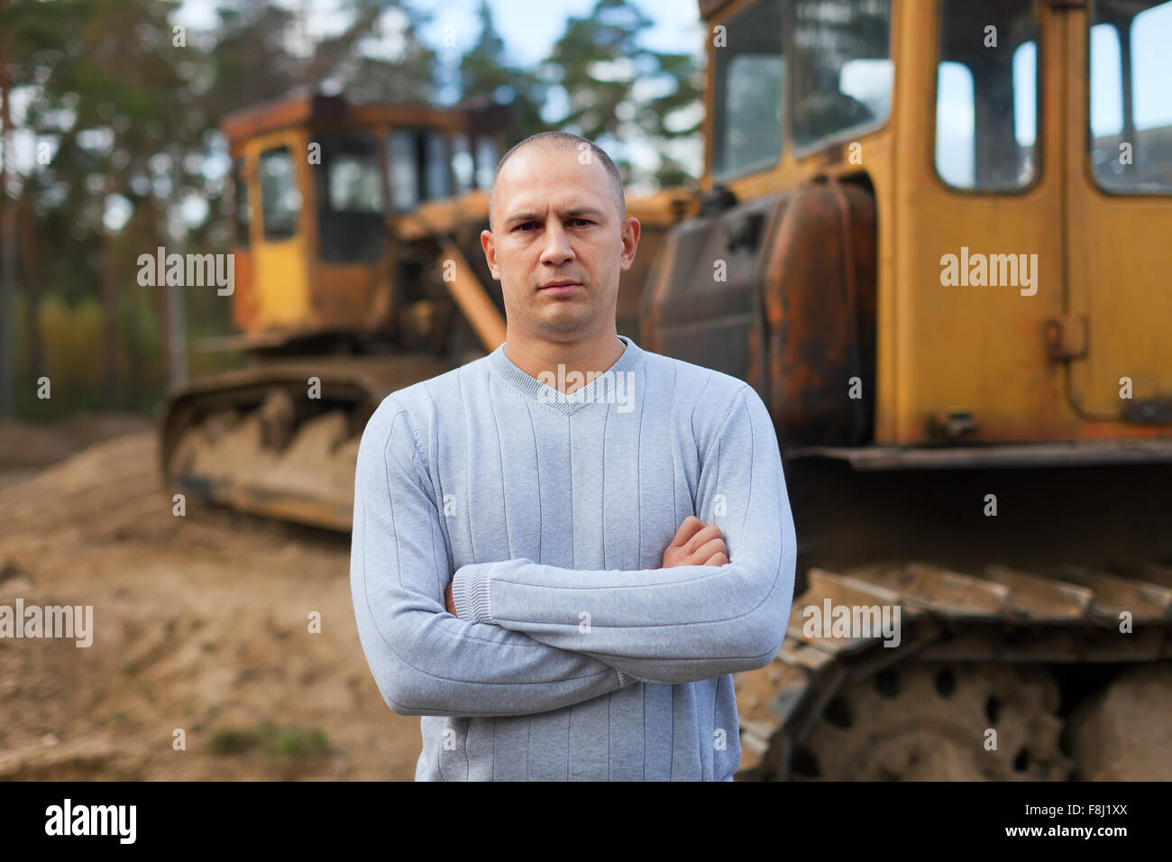Portrait of tractor operator at workplace Stock Photo - Alamy