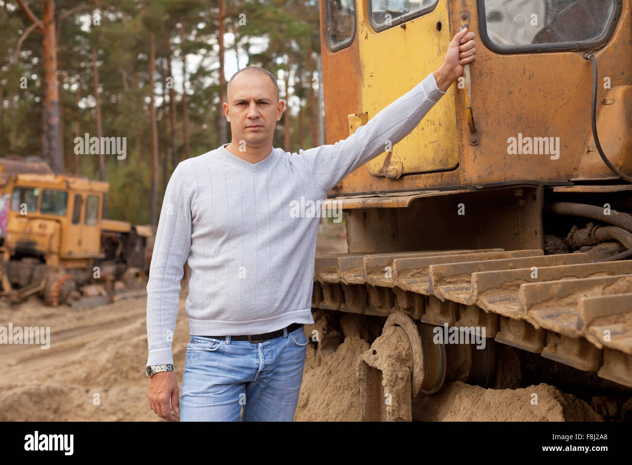 Portrait of tractor operator at workplace Stock Photo - Alamy