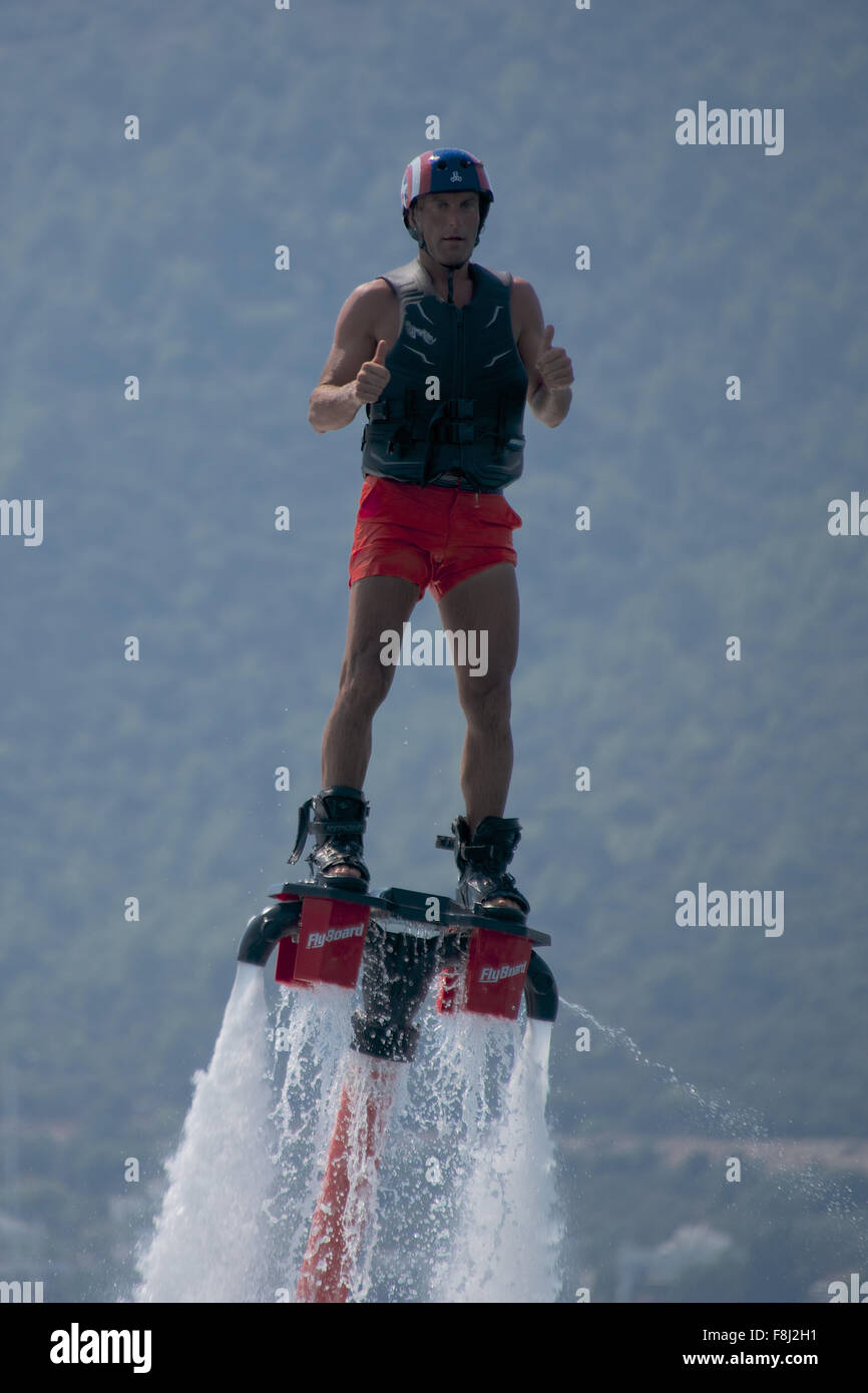 Close-up of serious Flyboarder giving double thumbs-up Stock Photo - Alamy