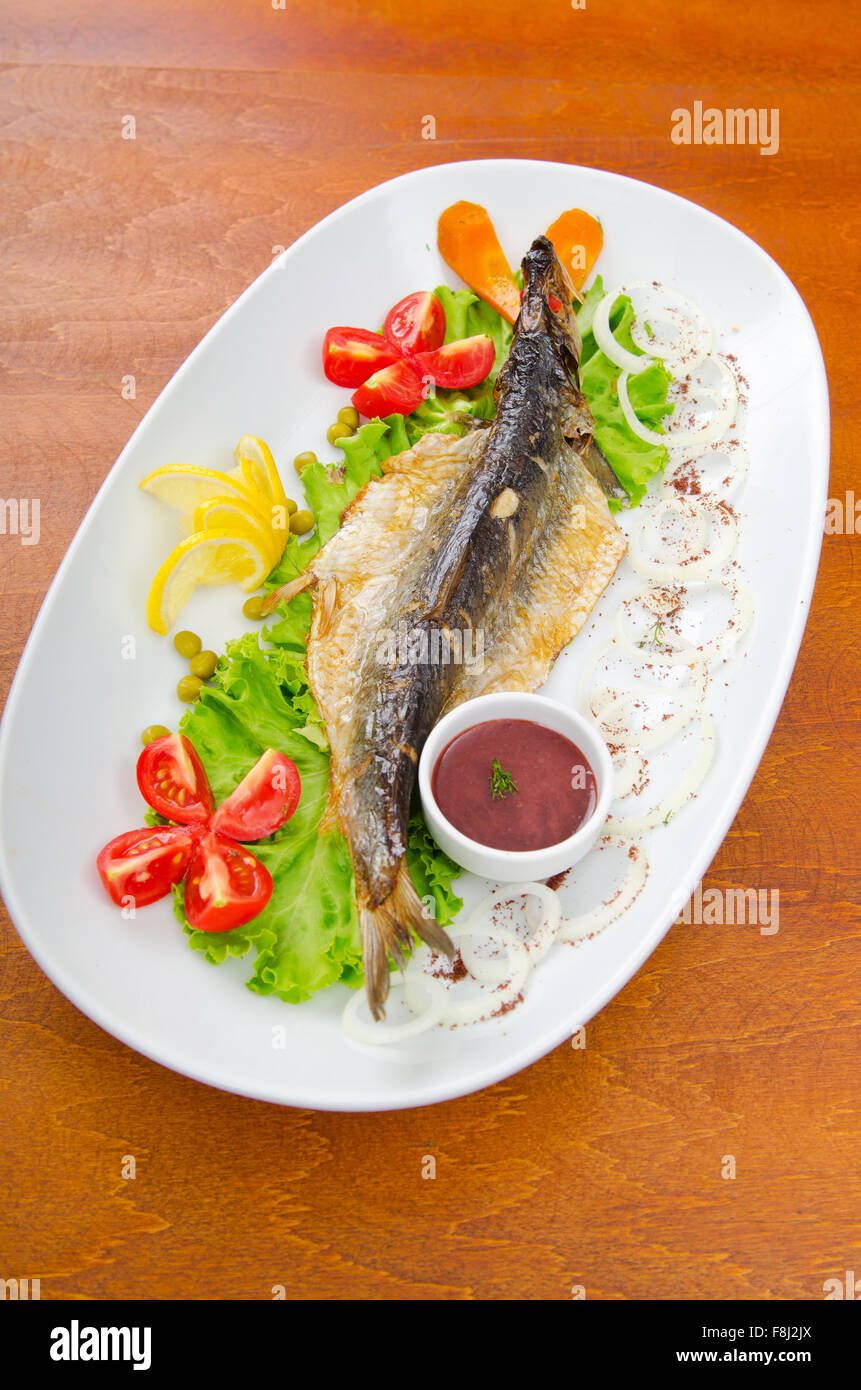 Fried fish in the plate Stock Photo - Alamy