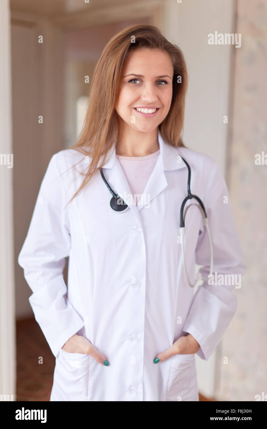 Portrait of friendly doctor in clinic interior Stock Photo - Alamy