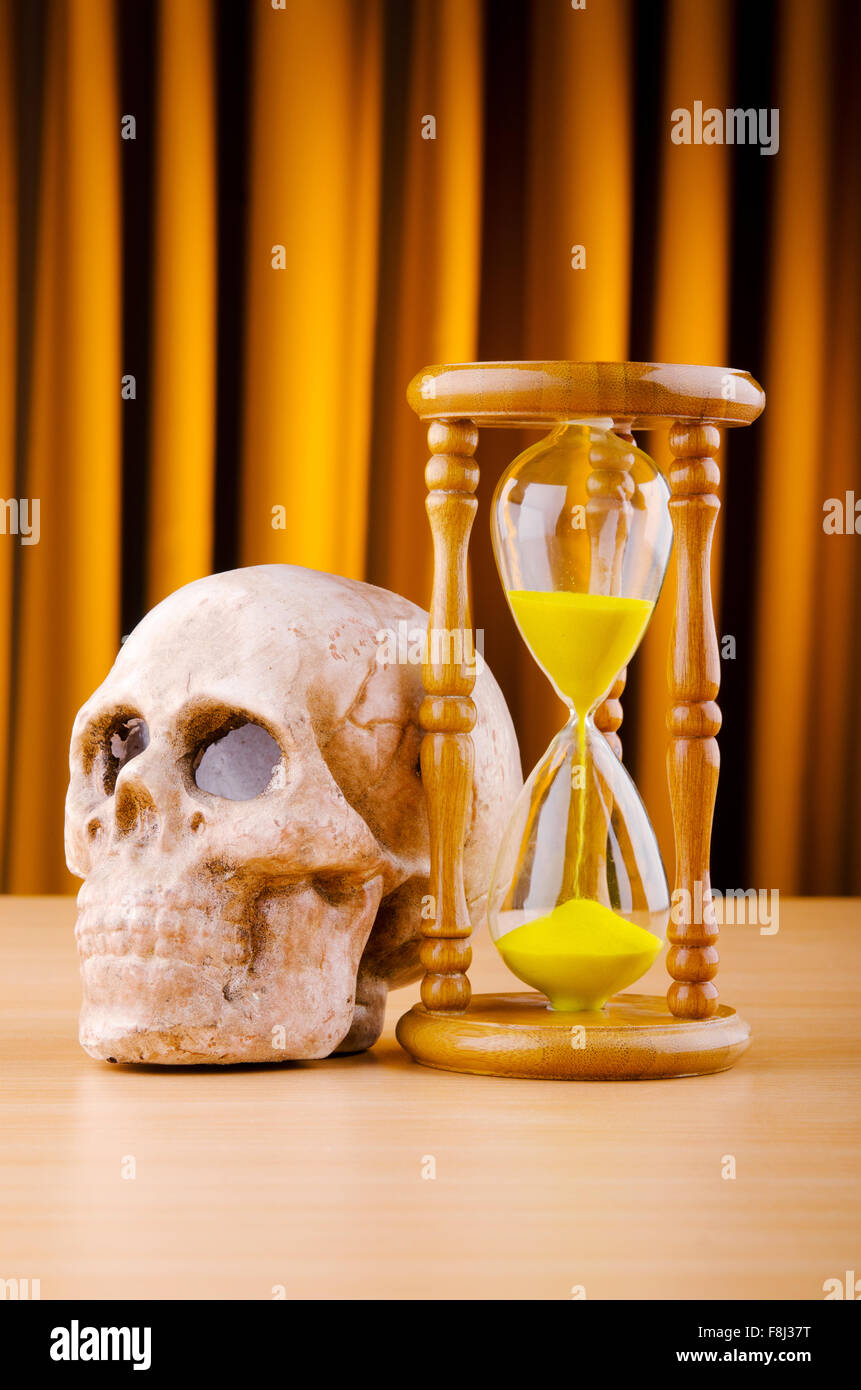 Concept death hourglass skull hi-res stock photography and images - Alamy