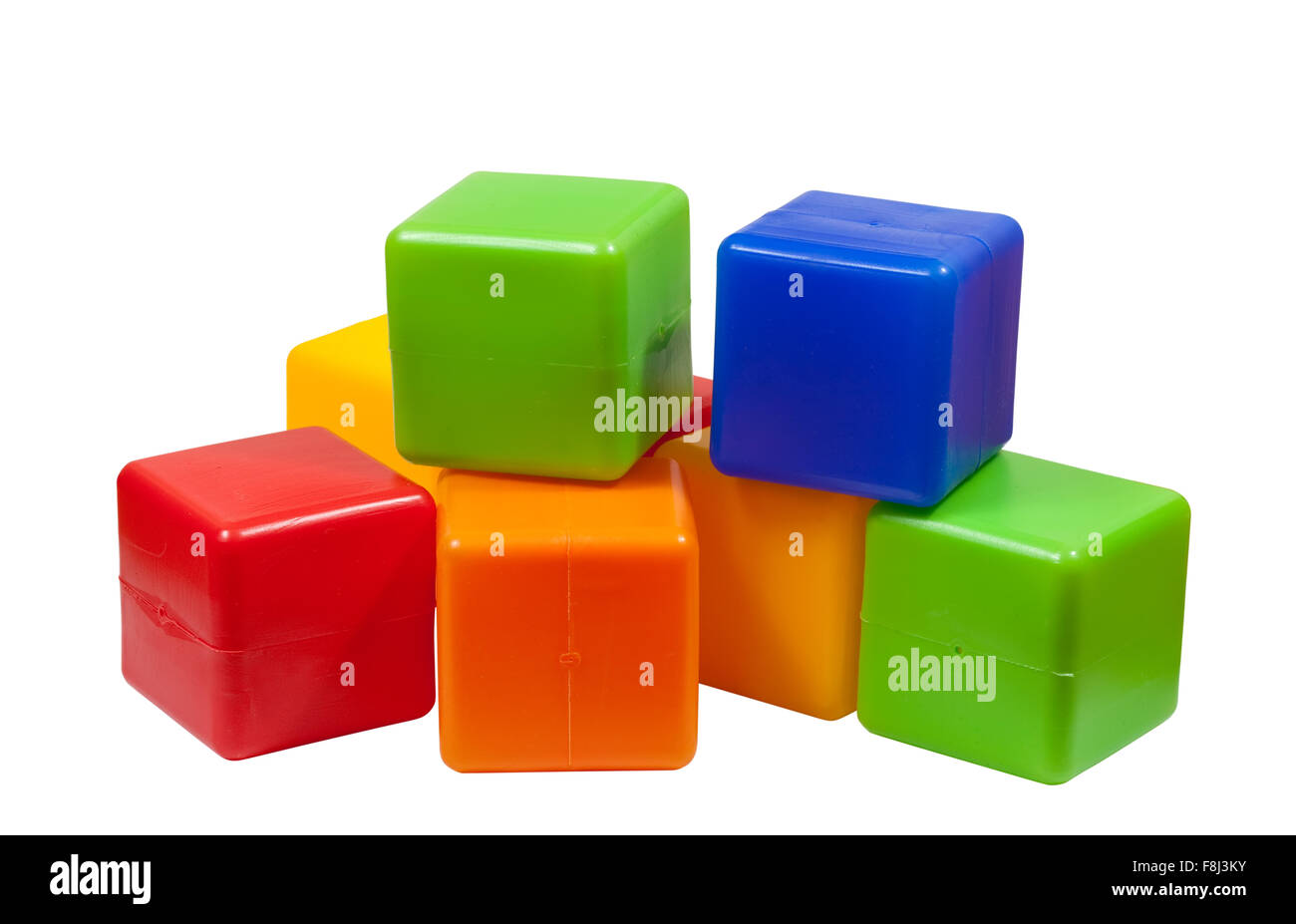 Few plastic toy blocks on white background Stock Photo - Alamy