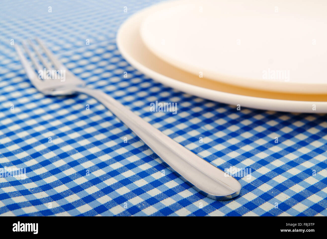 Empty plate with utensils Stock Photo - Alamy