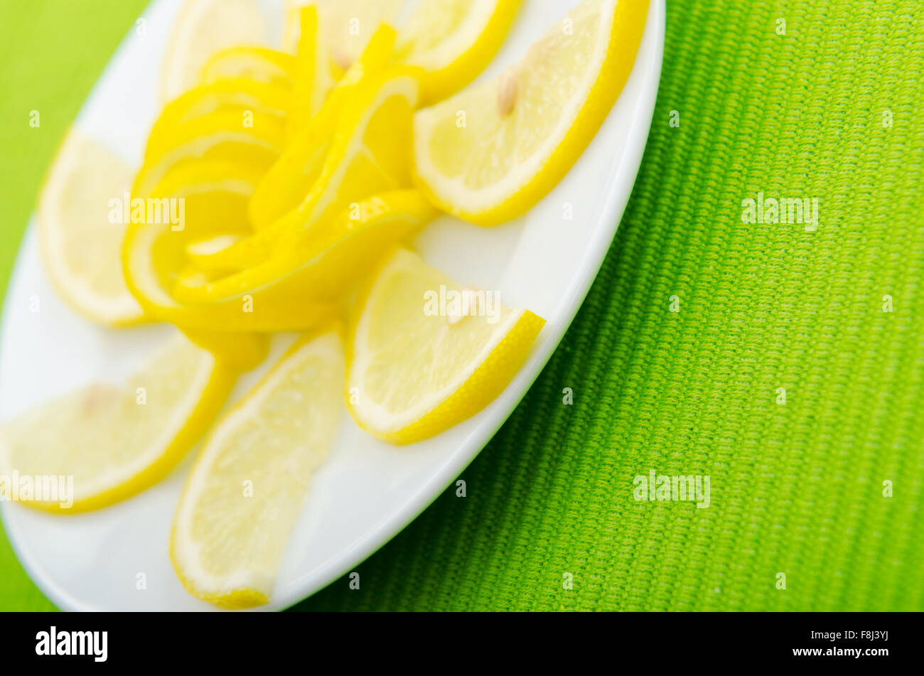 Lemon slices served in the plate Stock Photo - Alamy