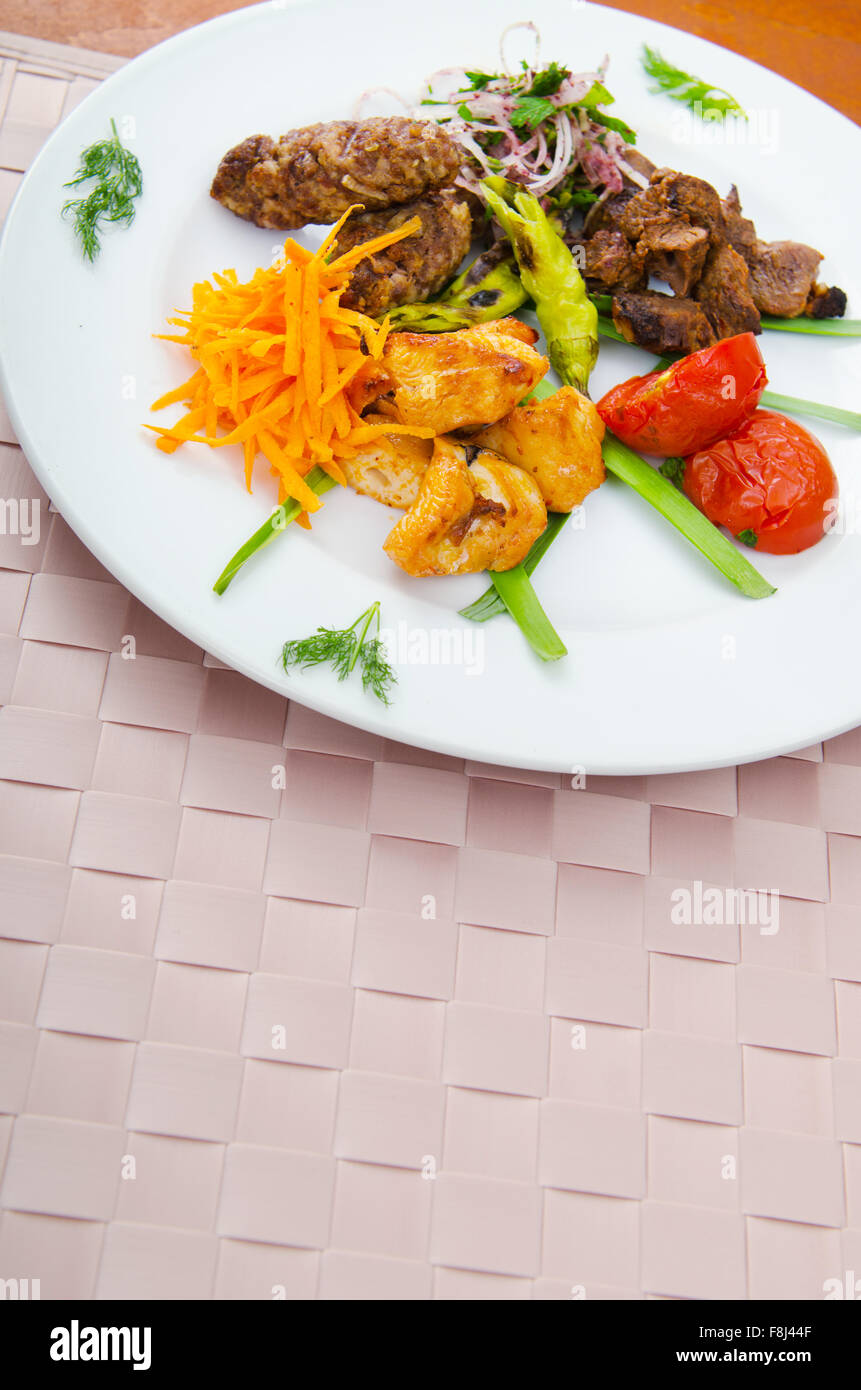 Plate with tasty lamp kebabs Stock Photo - Alamy