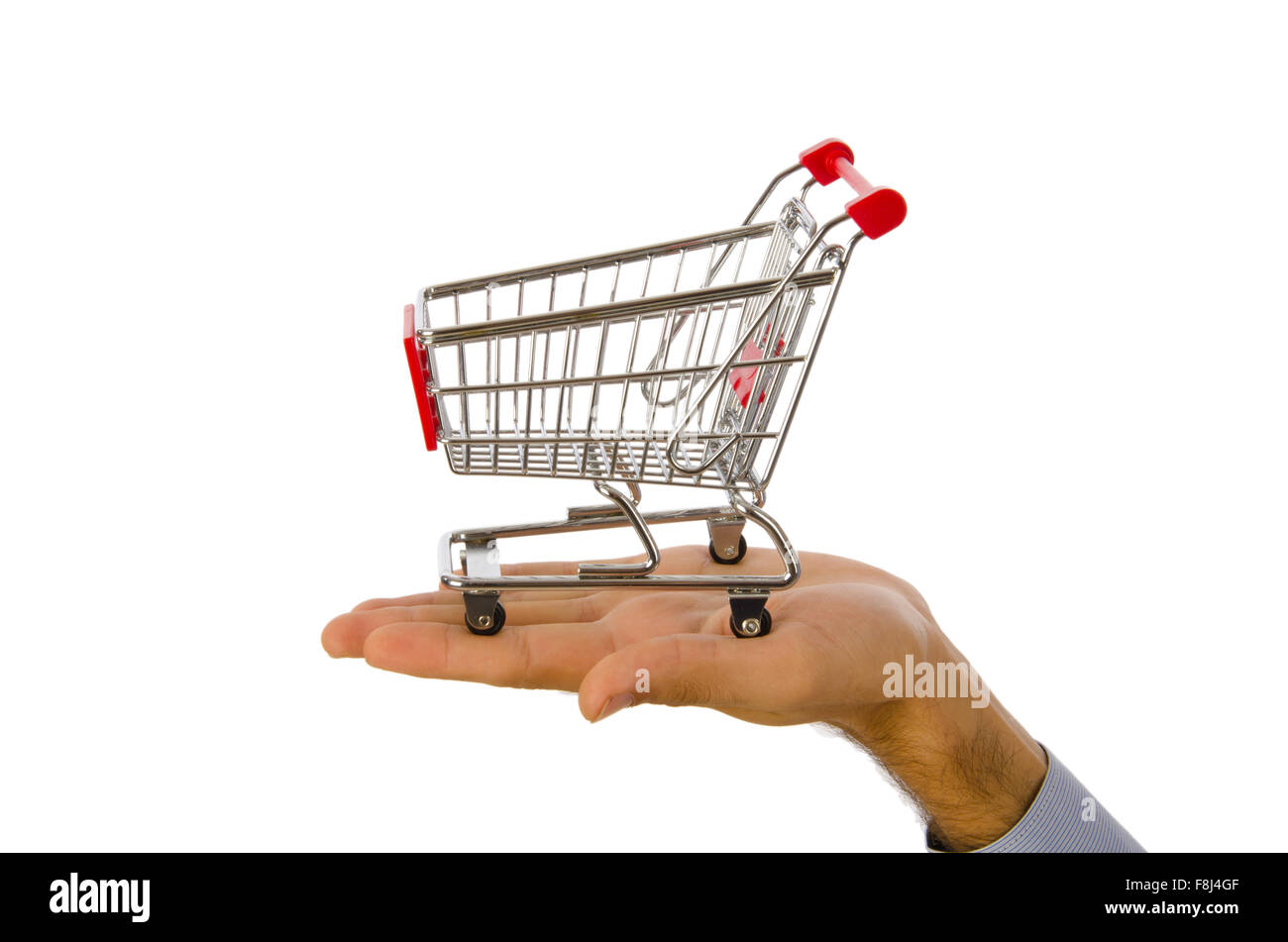 Hand holding shopping cart on white Stock Photo - Alamy