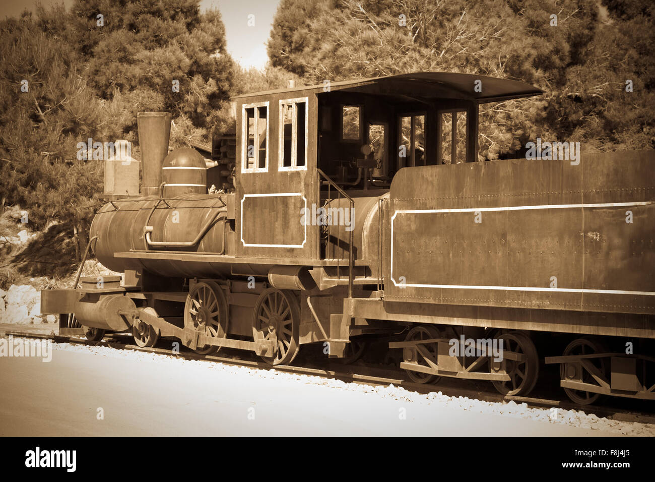 Retro photo of old steam locomotive at railway station Stock Photo - Alamy