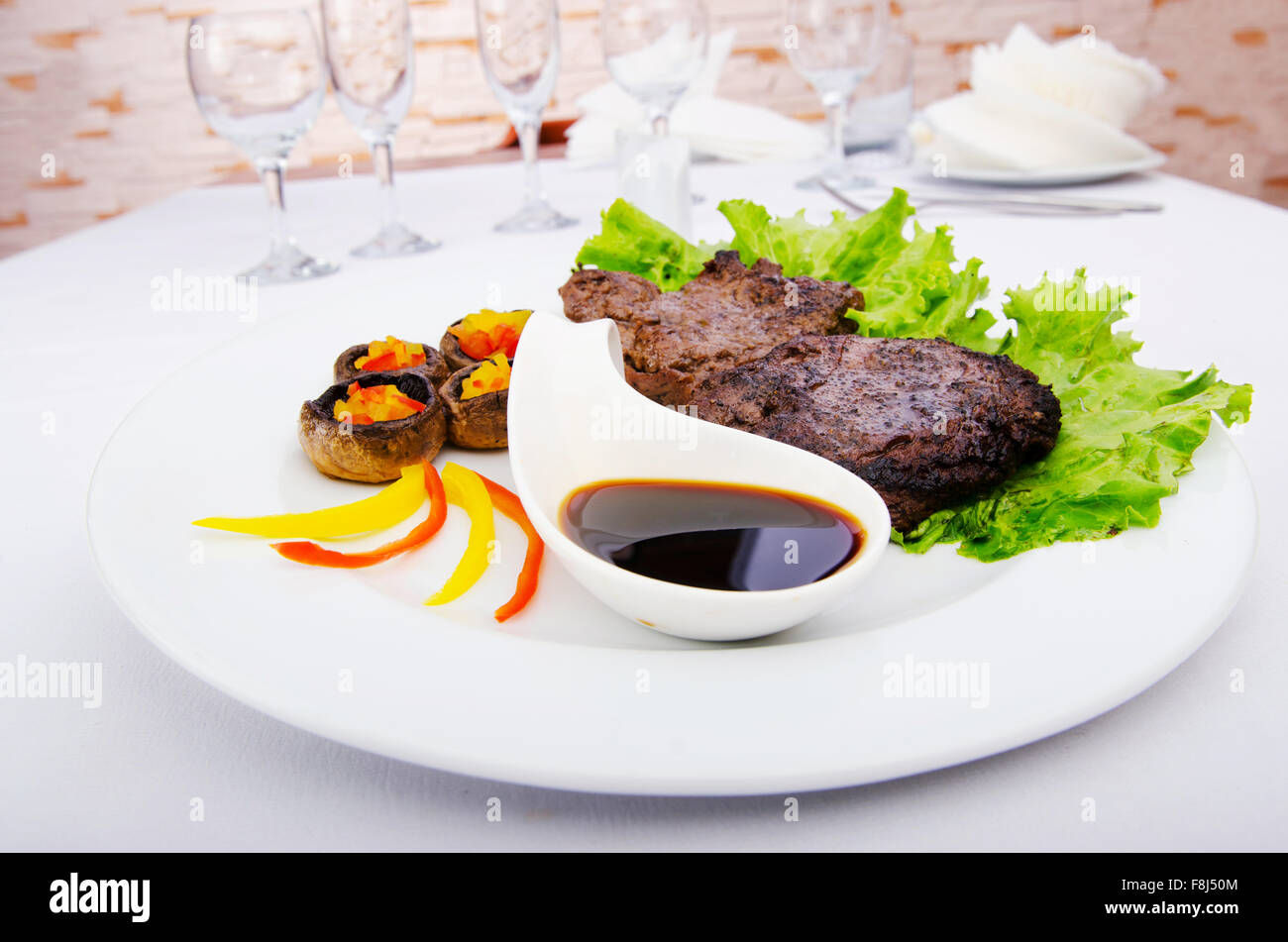 Well done steak served in the plate Stock Photo - Alamy