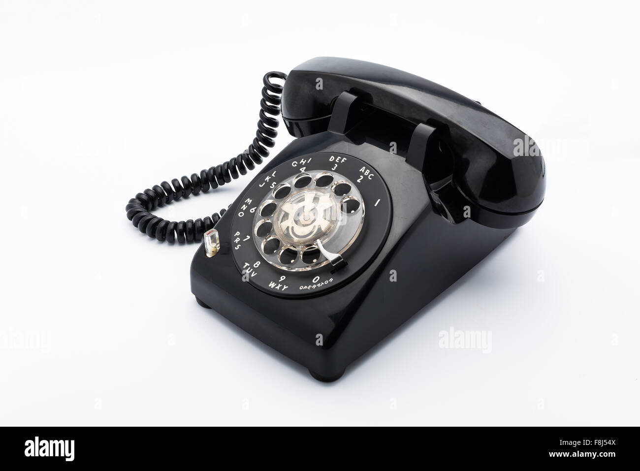Black old telephon with rotary dial on white background Stock Photo - Alamy