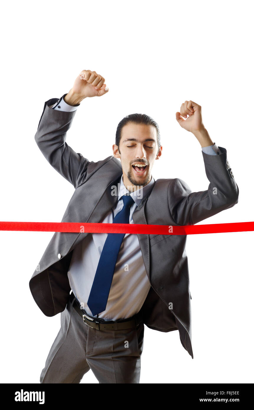 Businessman crossing finish line Stock Photo - Alamy