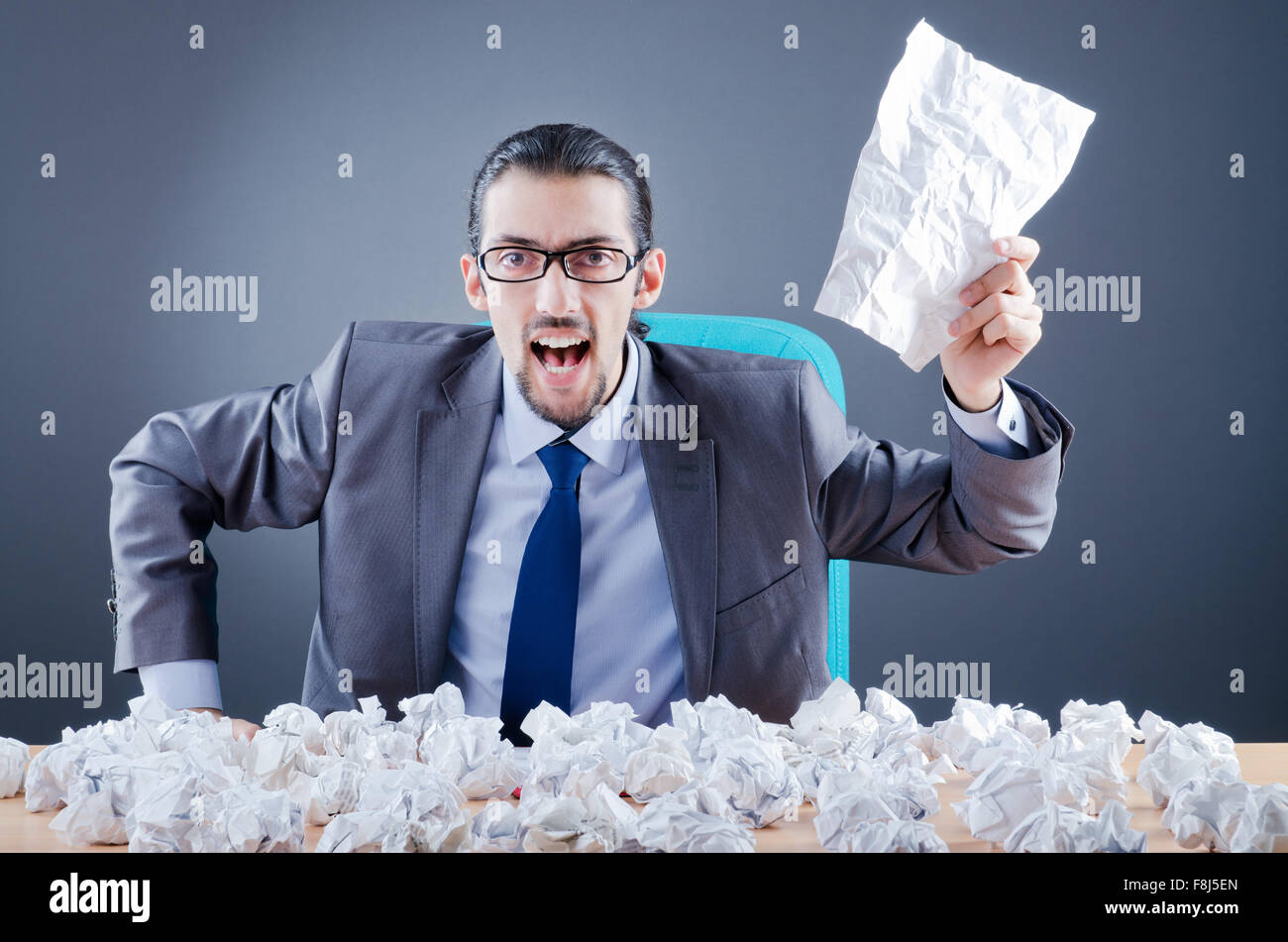 Businessman throwing paper away Stock Photo - Alamy