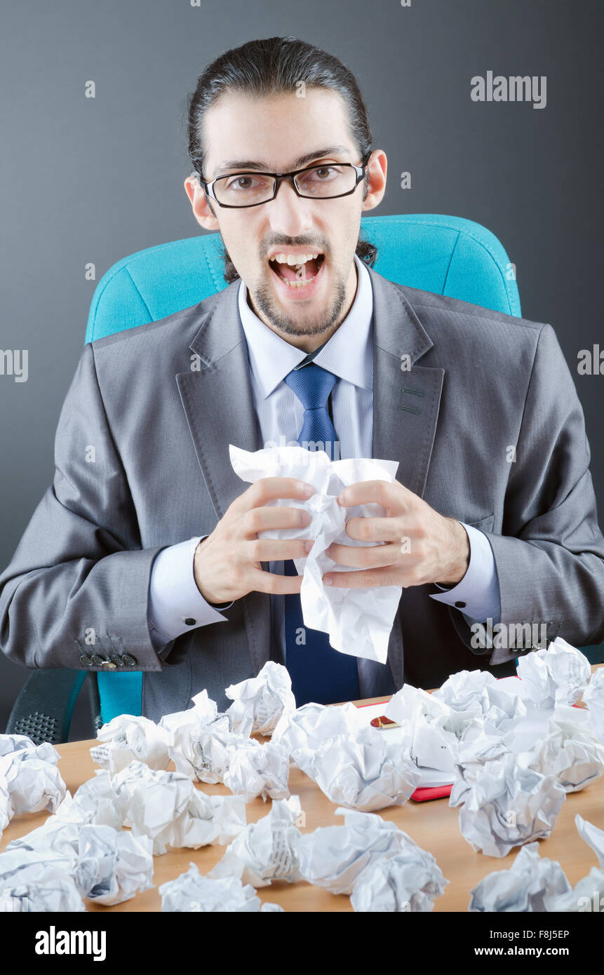Businessman throwing paper away Stock Photo - Alamy
