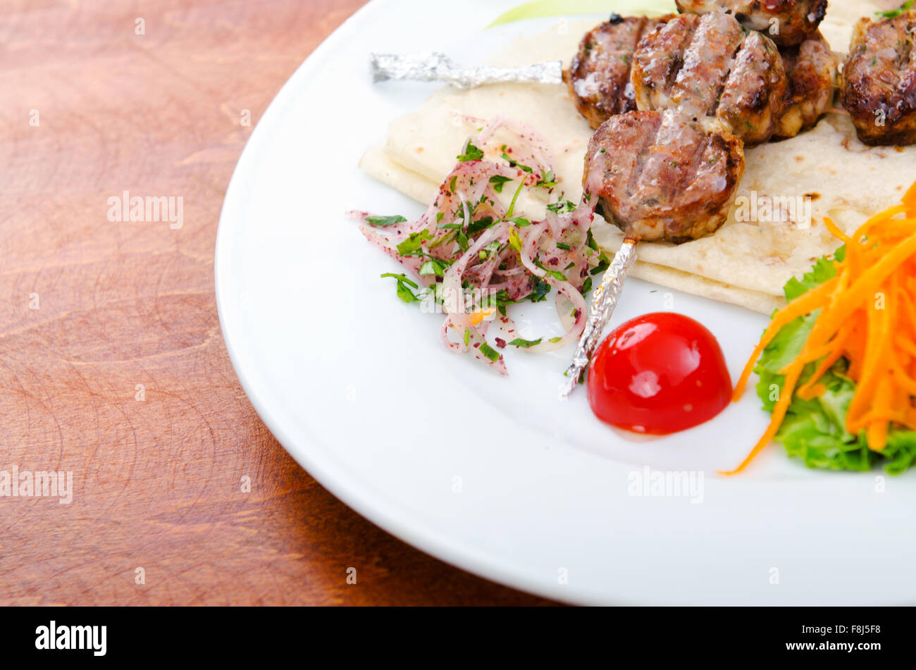 Meat cuisine - kebab served in plate Stock Photo - Alamy