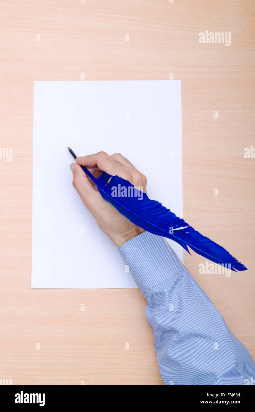 Man with quill writing Stock Photo - Alamy