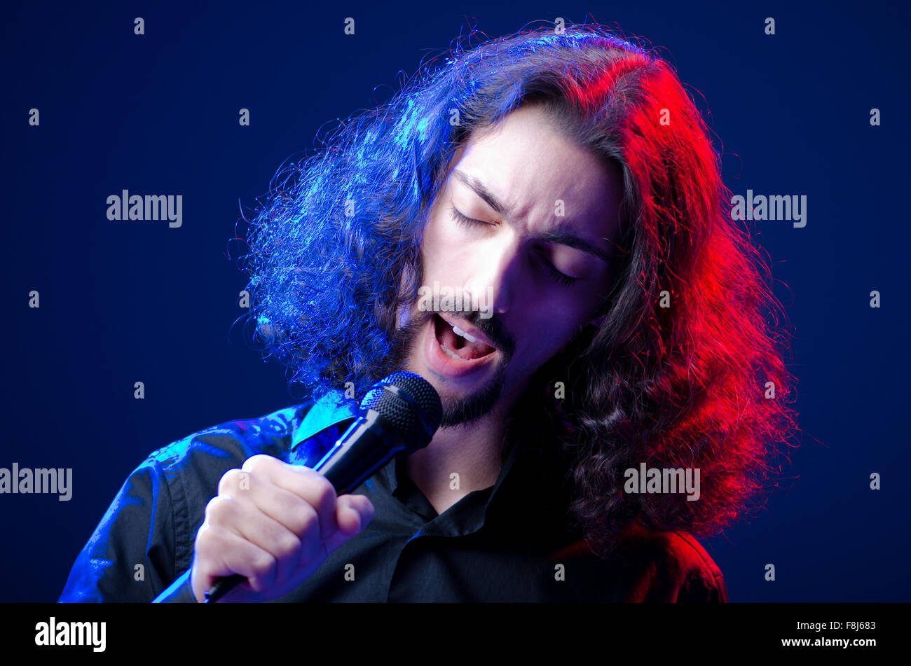 Man singing at the concert Stock Photo - Alamy